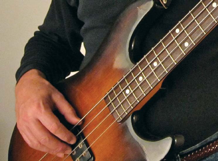 Hands Playing Bass Guitar